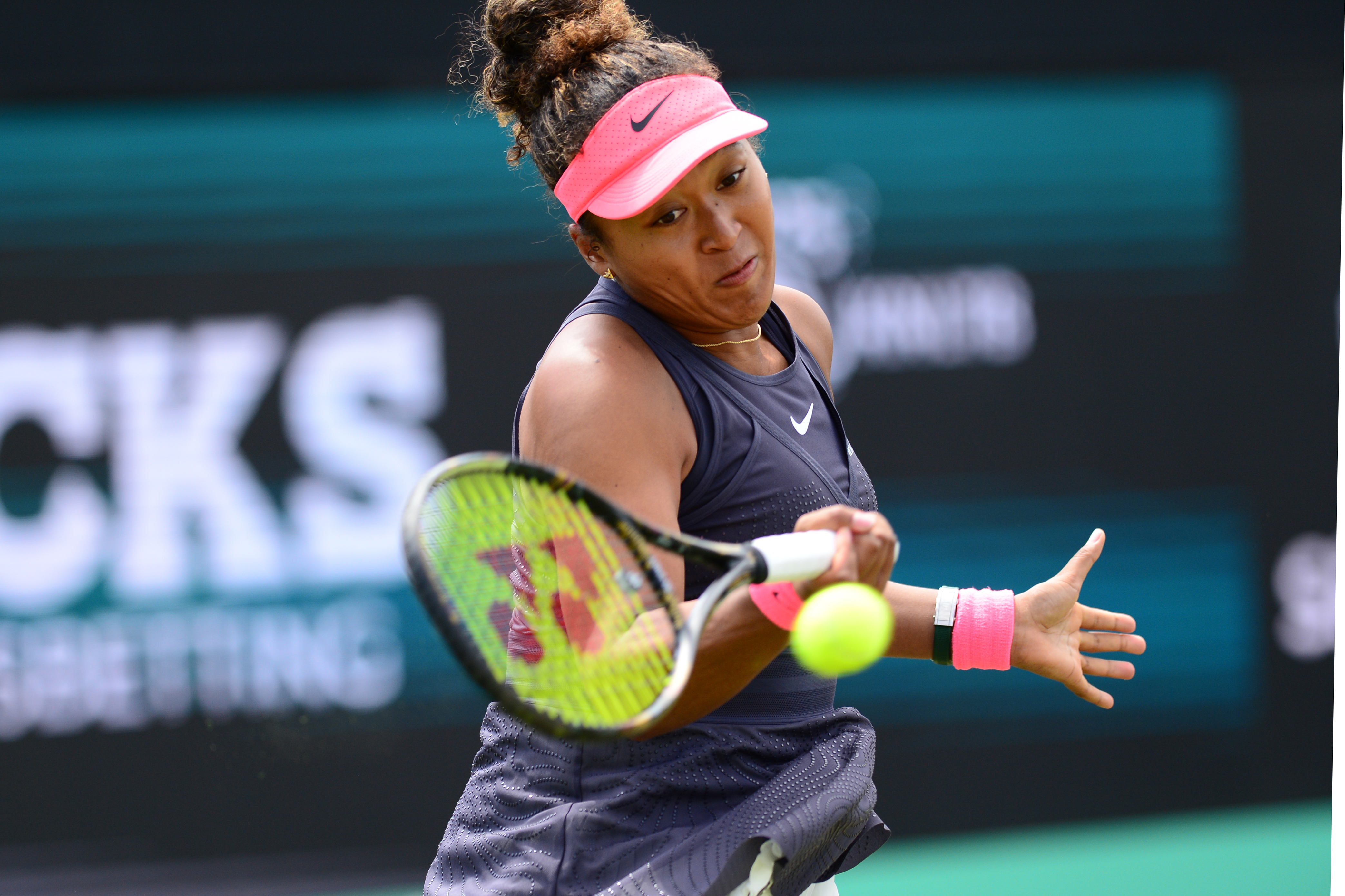 Osaka beats Mertens to win first grass-court match in five years